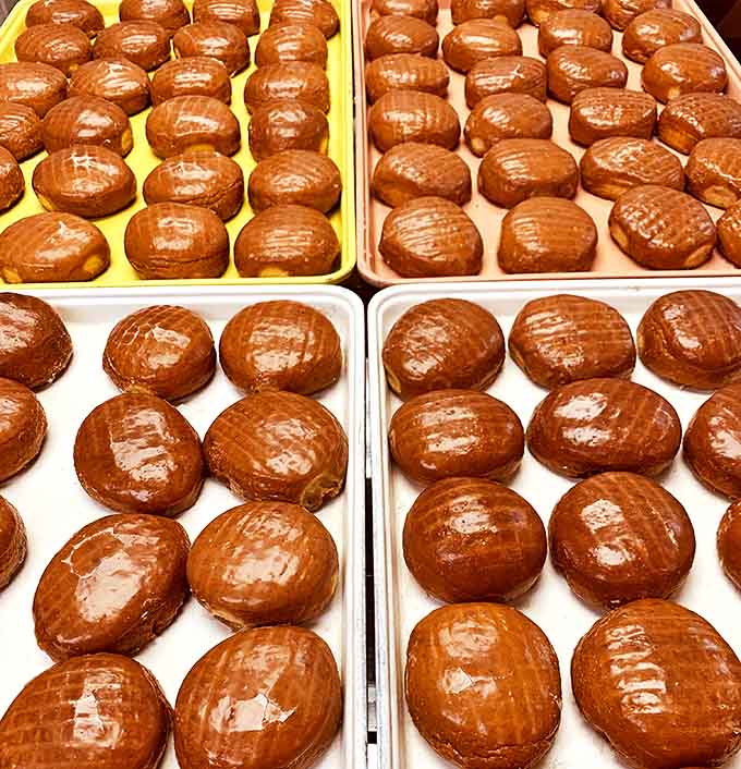 Glazed Donuts: Golden-brown perfection with a sheen so glossy you could practically check your reflection before devouring.