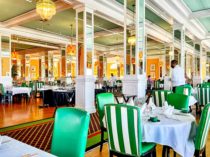 Mint green stripes embrace this charming bedroom, where Victorian elegance meets modern comfort in a symphony of patterns that somehow work perfectly together.