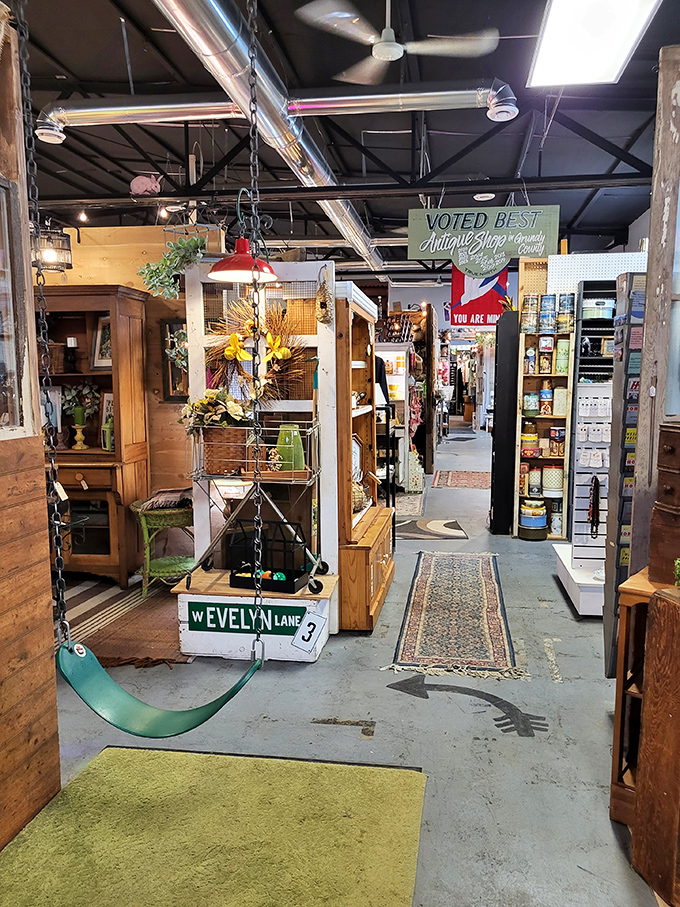 Wander down aisles where vintage furniture creates impromptu rooms, each turn revealing another perfectly imperfect vignette of American domestic history.