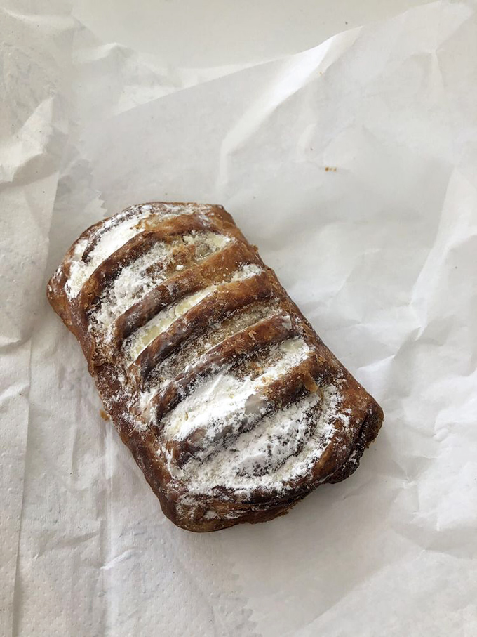 Hazelnut croissant: Dusted with powdered sugar like a winter morning in Stockholm, this pastry hides a rich hazelnut filling worth traveling for.