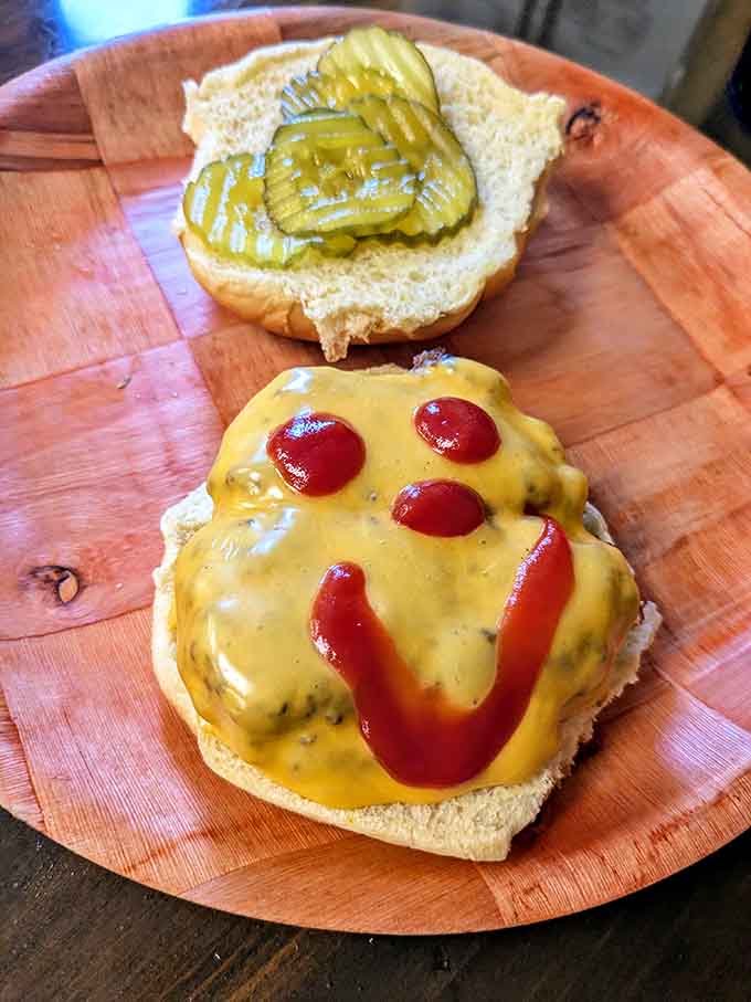 The cheeseburger arrives with melted cheese cascading over the edges, proving that sometimes classic is all you need.