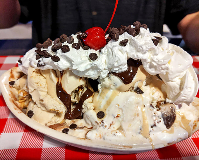 Whipped cream mountains topped with cherries and chocolate &ndash; proof that sometimes, too much of a good thing is exactly right.