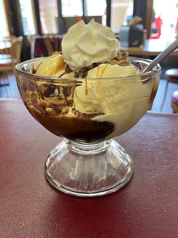 A masterpiece of hot fudge, vanilla ice cream, and crunchy nuts&mdash;proof that happiness can indeed be served in a bowl.