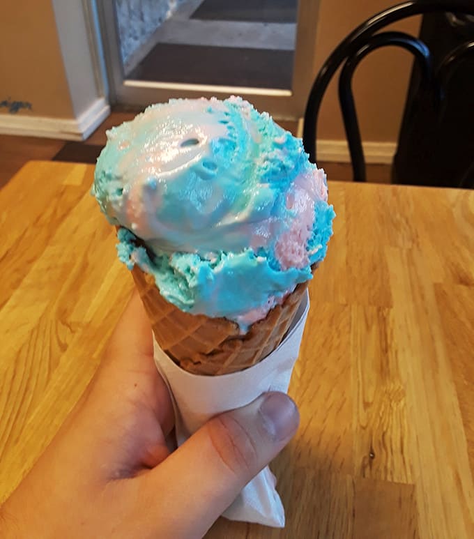 Cotton candy blue swirls meet creamy white in a cone that's basically summer vacation transformed into edible art.