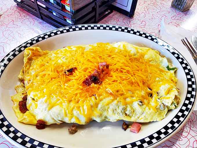Witness the miracle of eggs transformed into a fluffy yellow pillow stuffed with enough cheese to make Wisconsin proud.