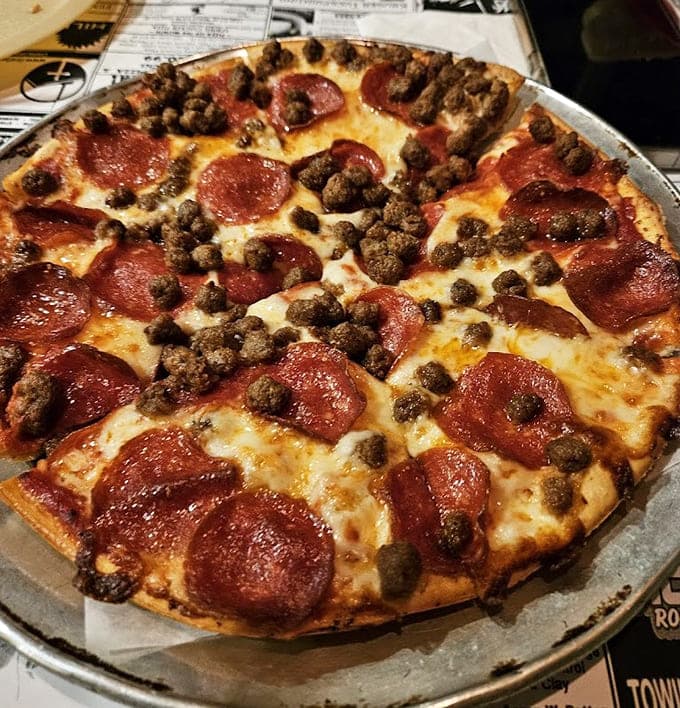 Pepperoni and sausage team up like the dynamic duo they were always meant to be on this glorious pie.