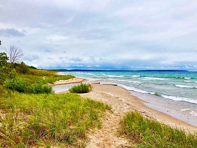The expansive shoreline stretches toward Empire Bluffs, offering plenty of space for beachgoers to claim their own slice of paradise.