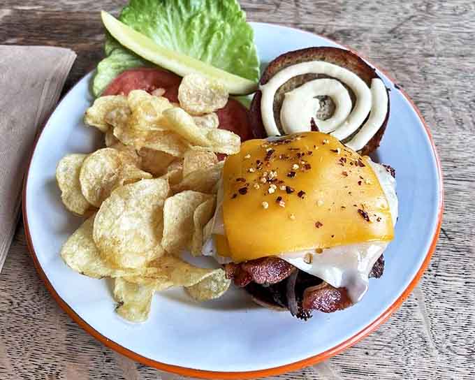 The Lambeau Leap burger doesn't just satisfy hunger &ndash; it tackles it with melty cheese, perfectly cooked beef, and toppings that score a touchdown with every bite.