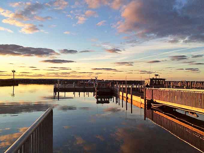 The day's grand finale turns the harbor into a mirror of golden light, reflecting both sky and soul.