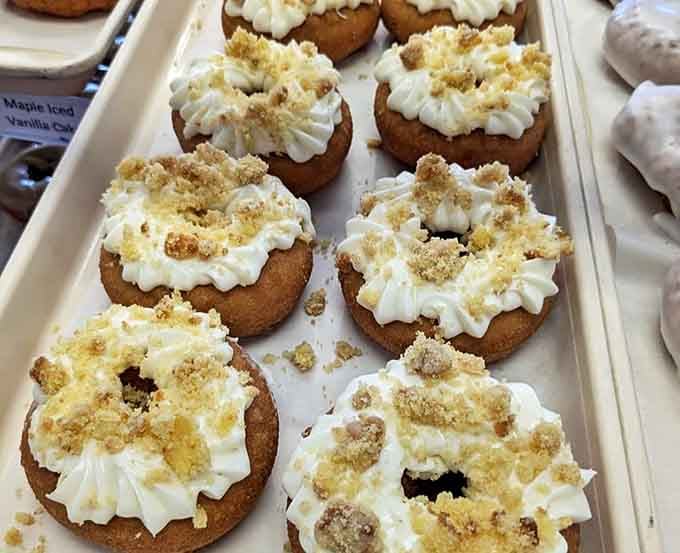 These cream-topped beauties with their crumbly garnish aren't just donuts &ndash; they're edible evidence that simplicity often trumps complexity.