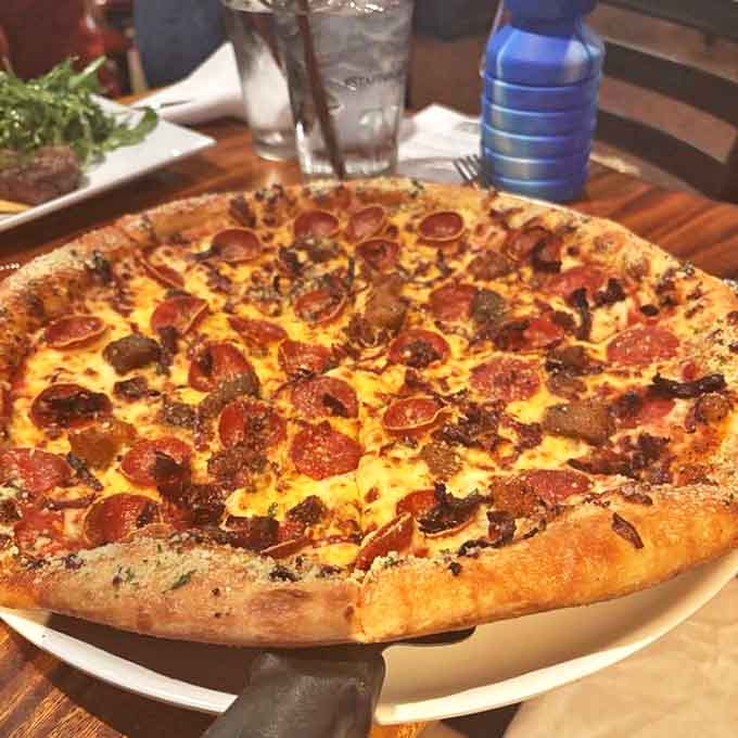 For when you can't decide which meat to enjoy, so you choose ALL of them. Carnivore heaven on a perfectly charred crust.