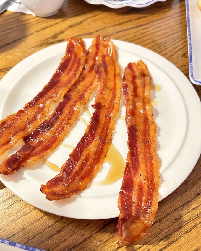This bacon achieves that mythical perfect crispness, shattering satisfyingly with each bite while still maintaining enough substance to remind you it's real food.