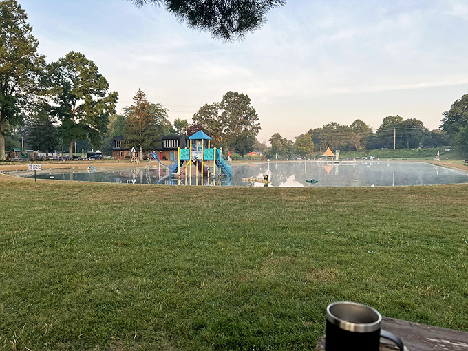 Morning at the park offers that rare combination of tranquility and anticipation, like the water itself is taking a deep breath before the day's splashing begins.