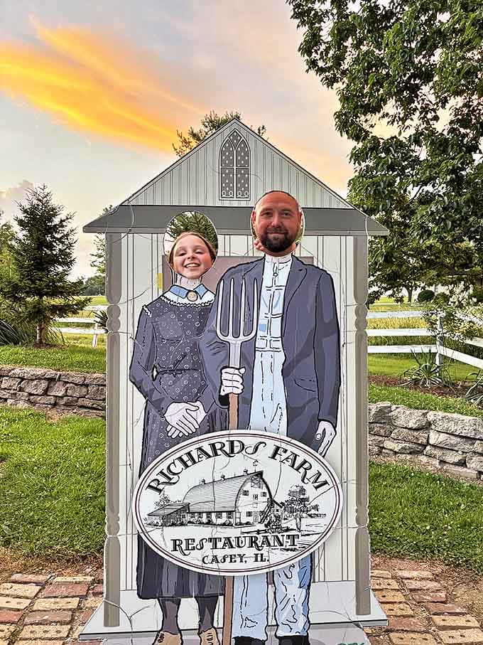 The face-in-hole photo board lets visitors pretend they're farmers capable of wielding this monster pitchfork.