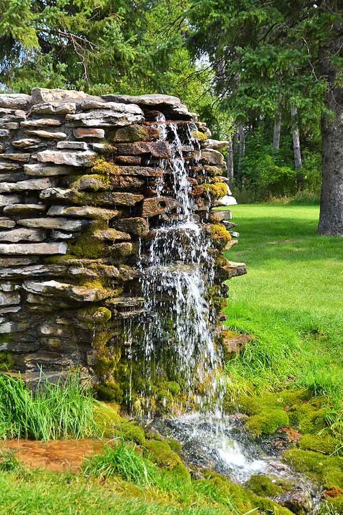 Norway Spring's crystal waters cascade over ancient stones, offering what locals swear is the purest, coldest, most refreshing drink in Michigan.