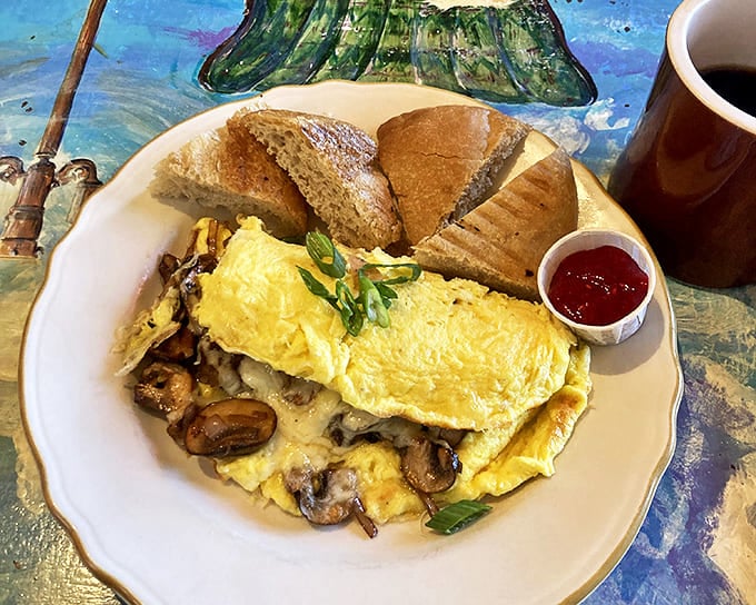 This mushroom omelet doesn't just whisper "good morning" – it belts out a full Broadway musical complete with dance numbers and a standing ovation.