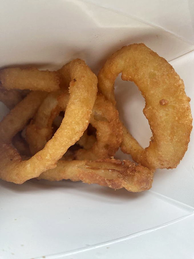 Thick-cut, sweet onions encased in a crunchy batter that somehow manages to stay intact until the very last bite.