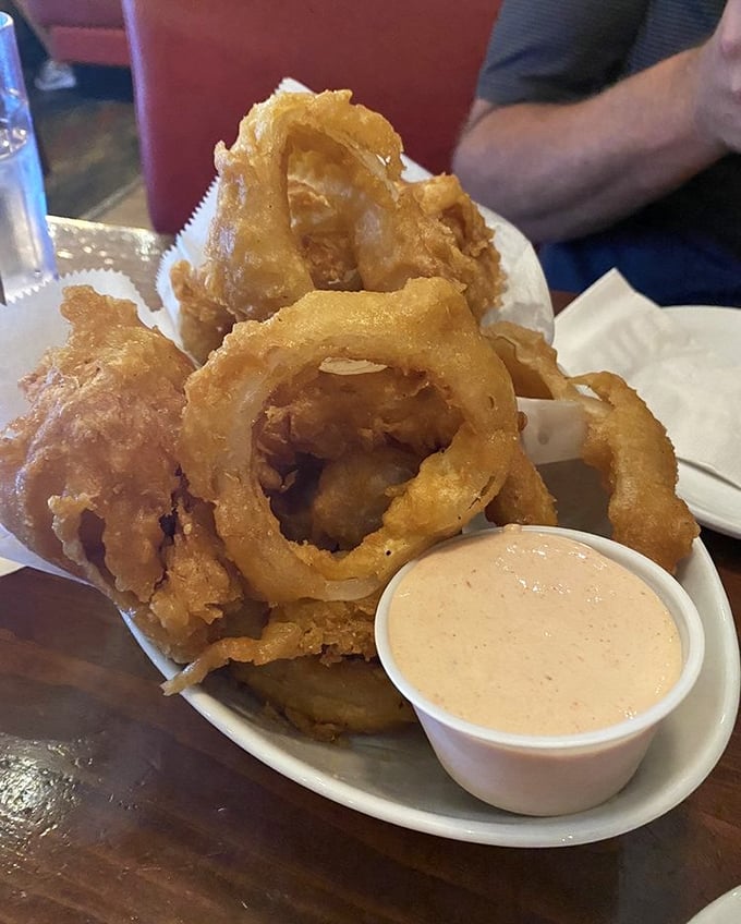 Golden, crispy onion rings that shatter satisfyingly with each bite &ndash; the perfect prelude to an unforgettable meal.