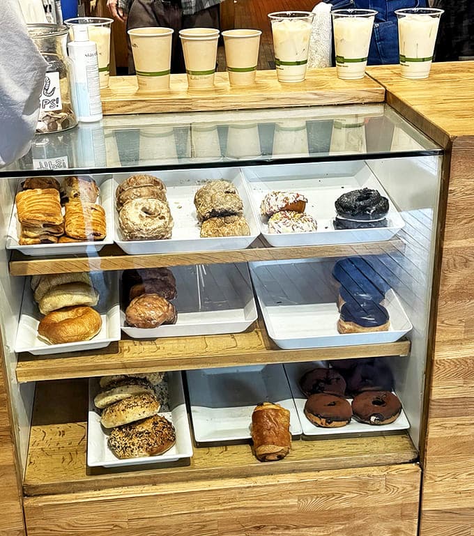 The pastry case tempts with flaky croissants, hearty bagels, and decadent donuts &ndash; the perfect companions to your carefully crafted beverage.