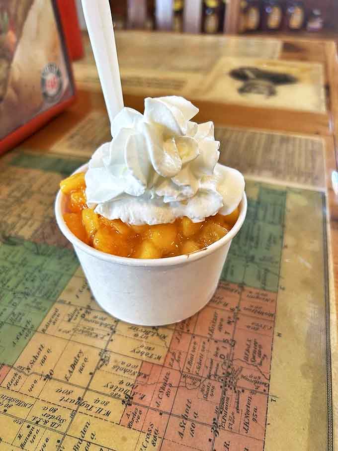 Summer captured in a cup – homemade peach ice cream topped with fresh peach compote that makes you want to write poetry or call your mother.