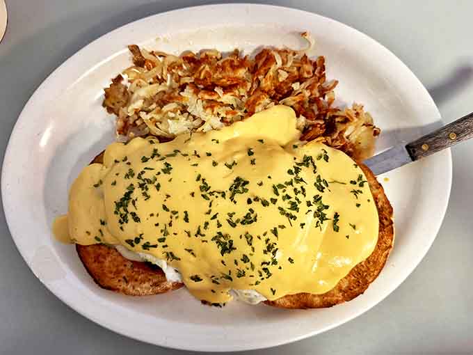 Eggs Benedict that would make the Pope jealous! Golden hollandaise cascades over perfectly poached eggs like a breakfast waterfall. The crispy potatoes are no mere sidekick.