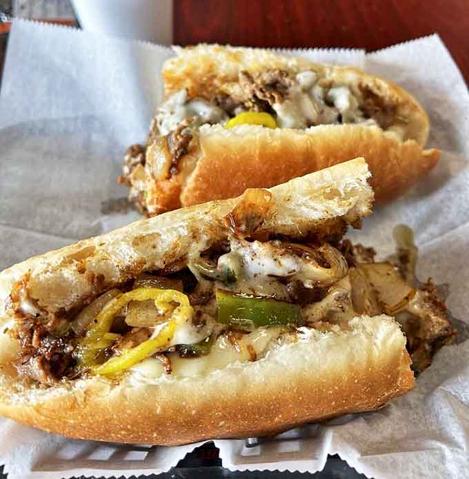 A little Italian dressing adds zing to Sam's already perfect cheesesteak &ndash; the kind of sandwich that makes you close your eyes with each savory bite.