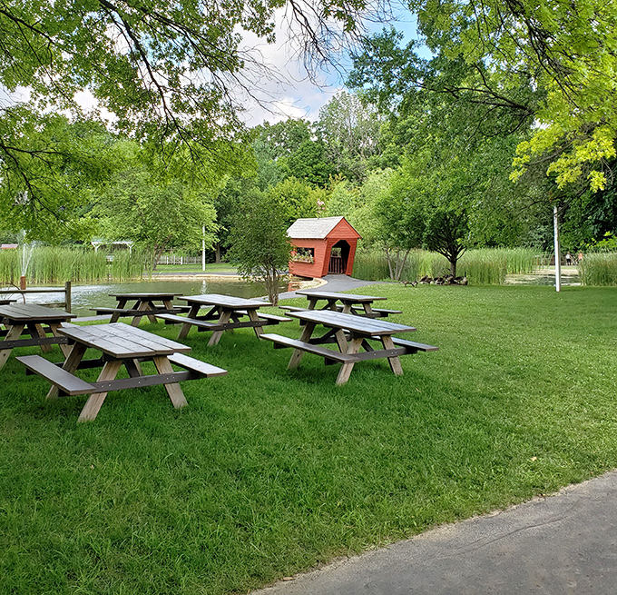 Picnic tables nestled under shade trees offer the perfect spot for sandwiches that somehow taste better when eaten outdoors.