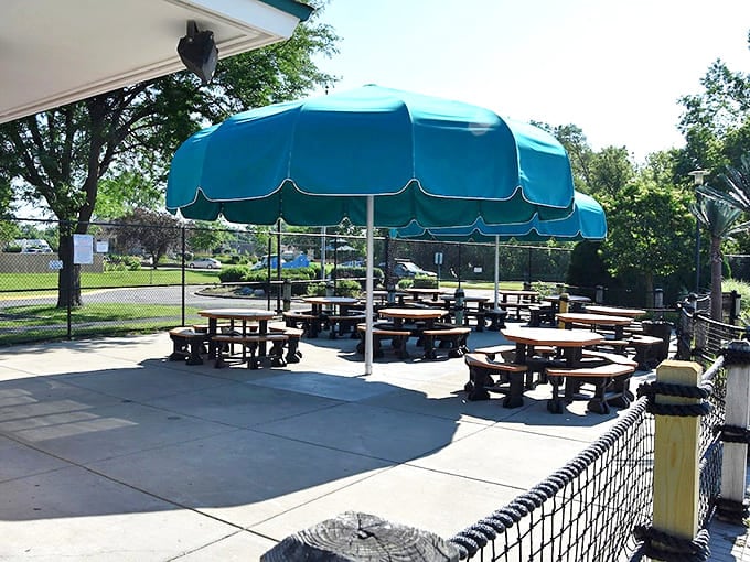 Shaded picnic tables await families ready to refuel – where simple sandwiches transform into gourmet fare after hours of swimming.