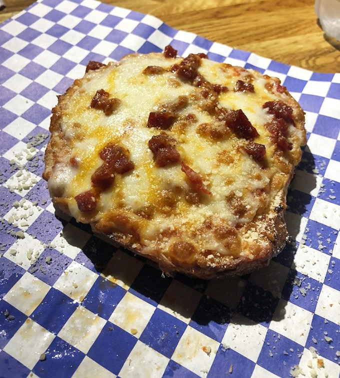 The humble pizza bagel gets an artisanal upgrade with melted cheese and savory toppings &ndash; nostalgia never tasted so sophisticated.