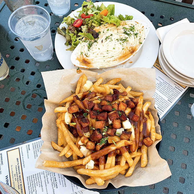 Comfort food perfection: golden poutine loaded with braised beef and cheese curds alongside shepherd's pie with its signature browned potato topping.