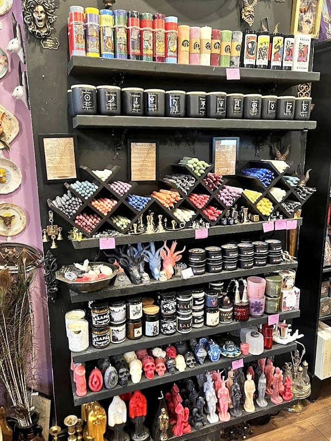 A rainbow arsenal of ritual candles stands ready for deployment, their colorful wax vessels promising everything from protection to prosperity.