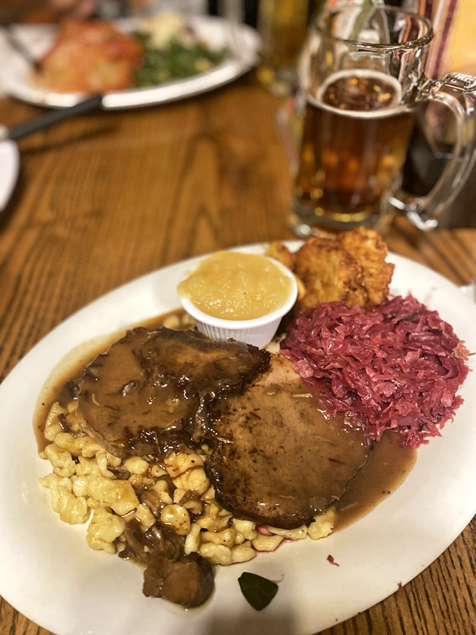 Sauerbraten that's been marinating longer than some relationships last, served with sp&auml;tzle and red cabbage that adds a pop of color and tang.