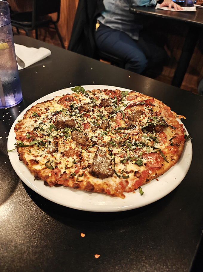 A sausage pizza that makes other pizzas jealous &ndash; perfectly distributed toppings, that golden crust, and cheese that's achieved melty perfection.