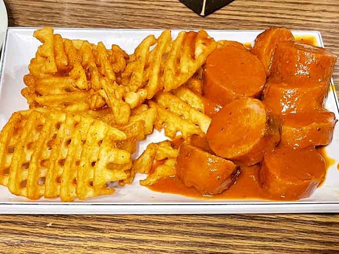 Currywurst meets waffle fries in a combination that's part German tradition, part modern indulgence, and entirely worth the calories you're about to consume.