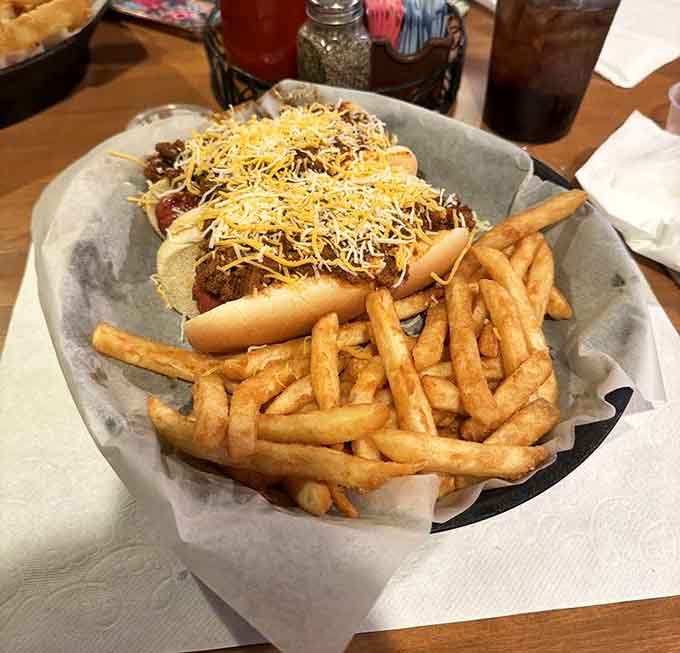 Chili, cheese, and onions pile high on these Coney dogs, creating the kind of messy, delicious situation that requires extra napkins.