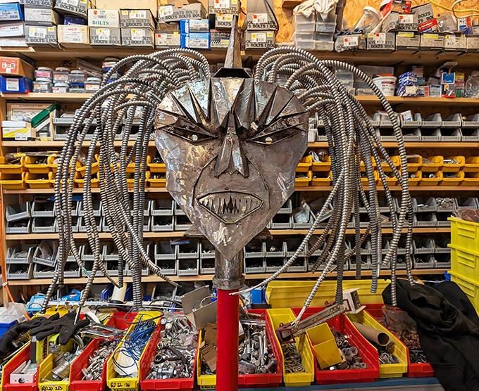 Workshop wizardry reveals the metal magic behind the monsters &ndash; this fierce face with conduit dreadlocks awaits its mechanical body.