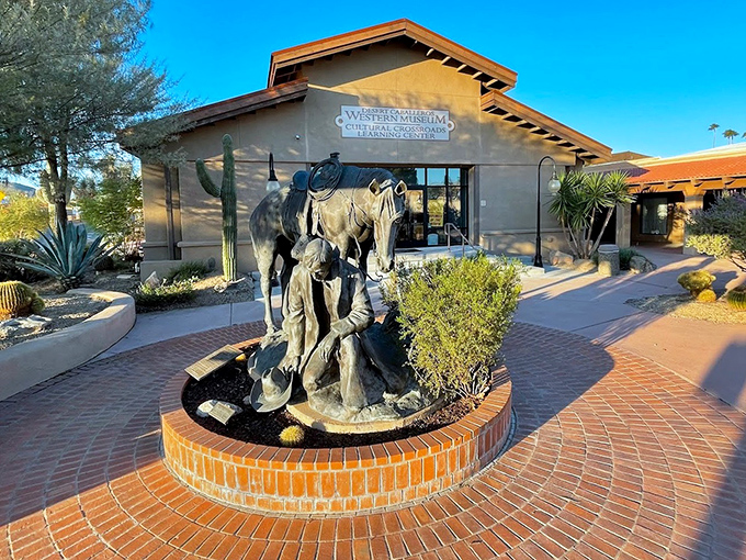 The Desert Caballeros Western Museum entrance, featuring Western sculpture that hints at the treasures waiting inside.