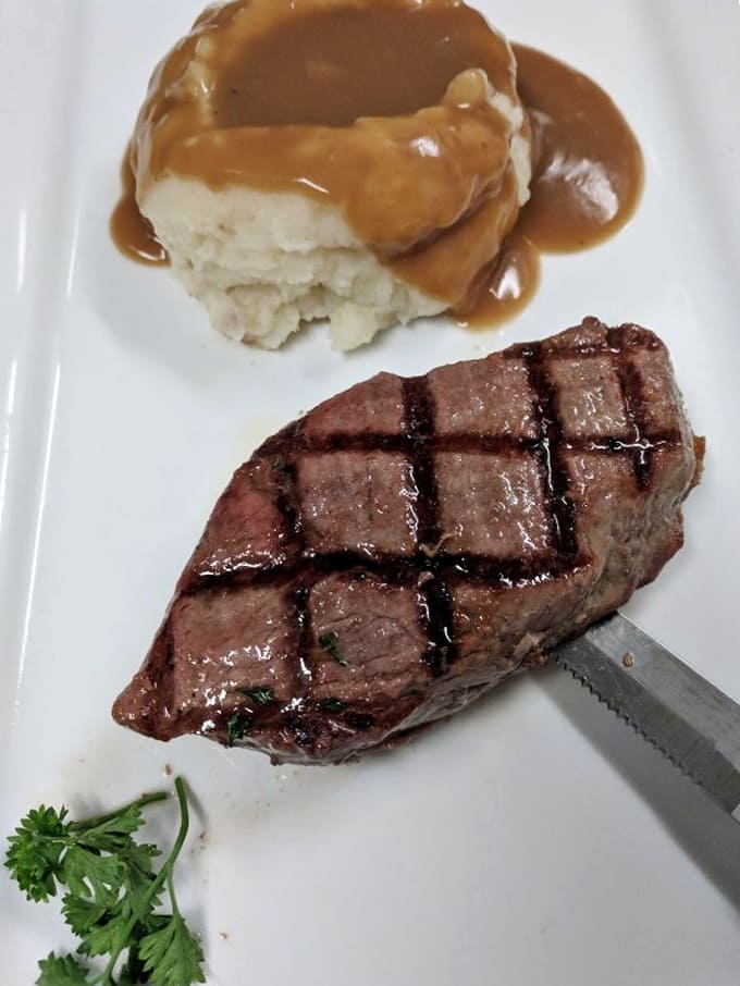 Perfectly grilled sirloin with mashed potatoes that weren't born in a box &ndash; comfort food that respects your intelligence.