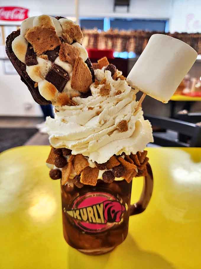 S'mores lovers, meet your new obsession: a towering shake topped with graham crackers, marshmallows, and chocolate-covered everything.