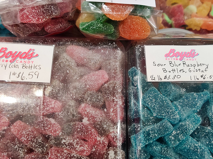 Sour blue raspberry bottles promise a pucker-worthy adventure – candy that's both a flavor experience and a facial workout.