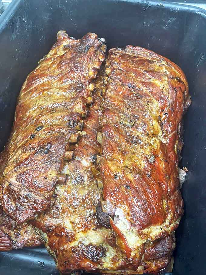 Ribs that showcase the pitmaster's art &ndash; glistening, tender, and bearing that telltale smoke ring that says "we took our time."
