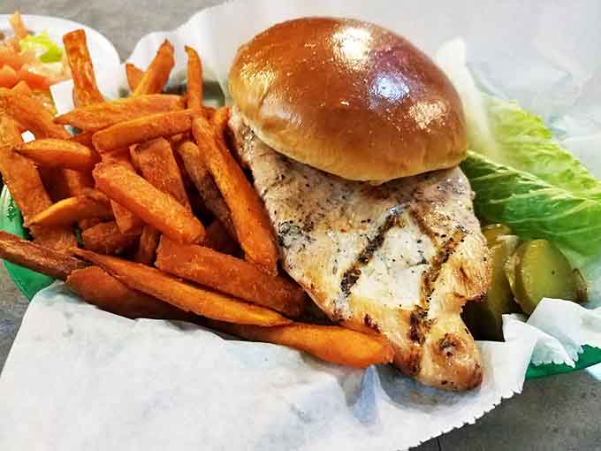 Spicy chicken sandwich with sweet potato fries&mdash;when you want heat and sweet in perfect harmony, delivered by miniature railroad.