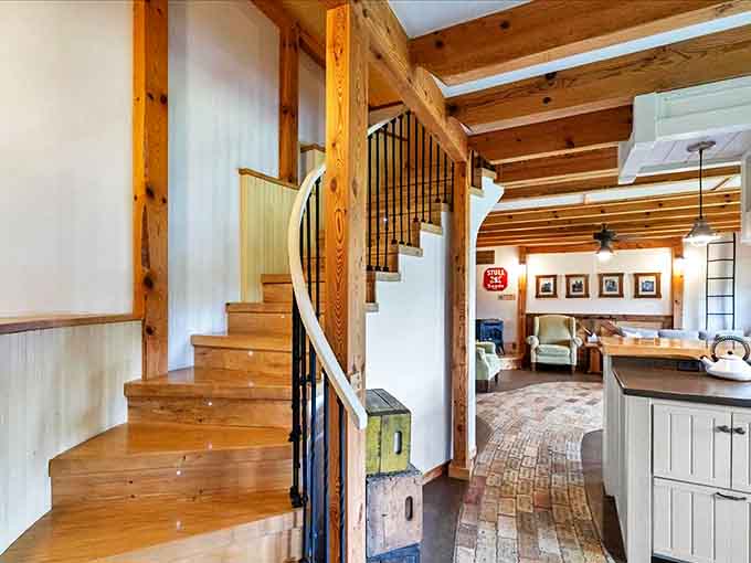 The staircase isn't just functional – it's a sculptural element that connects different levels while showcasing the craftsmanship that defines this unique space.