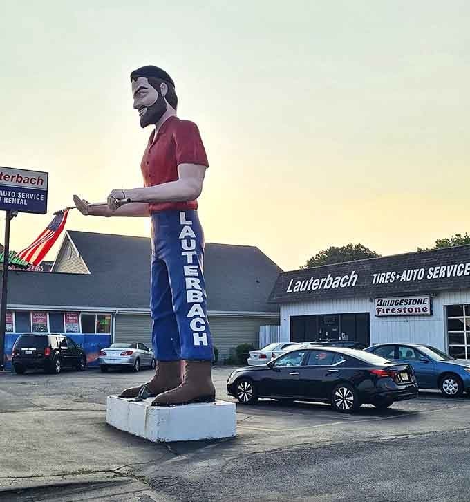 Golden hour casts a magical glow on this roadside legend, his silhouette standing tall against the twilight sky.