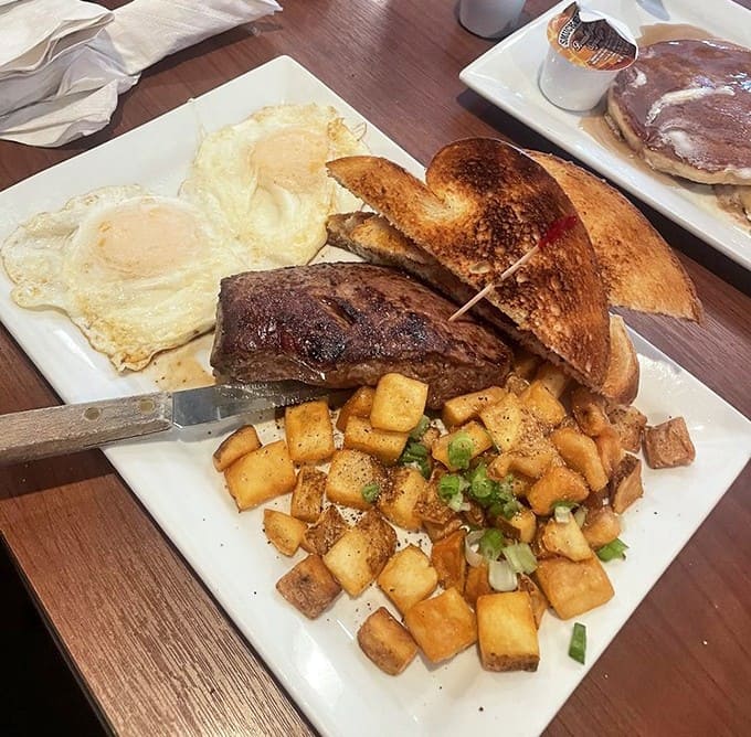 The breakfast of champions: perfectly cooked eggs, seasoned home fries that could make a potato weep with joy, and toast ready for its close-up.