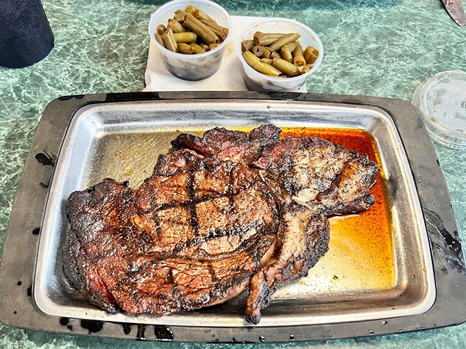 A perfectly grilled steak showing off those beautiful char marks. That's a delicious-looking dinner from Portsmouth!
