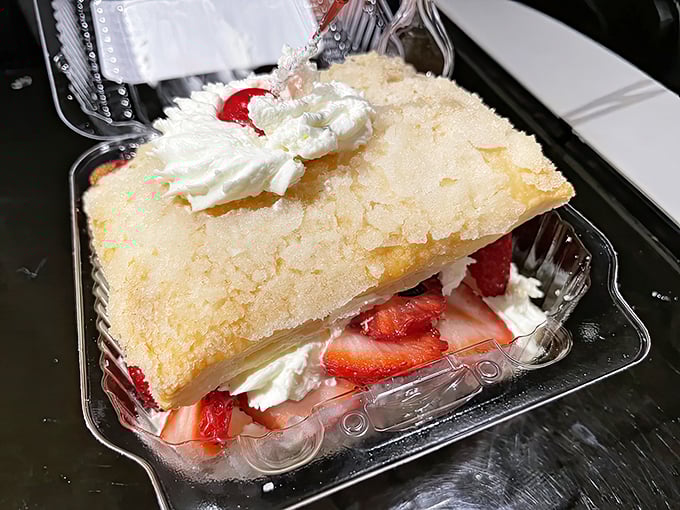 A slice of strawberry pillow dessert that somehow manages to look both cloud-light and decadently rich at the same time.