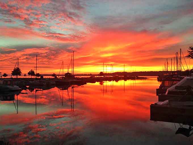 Mother Nature showing off her evening wardrobe &ndash; Suttons Bay sunsets paint the sky with colors no artist could fully capture.