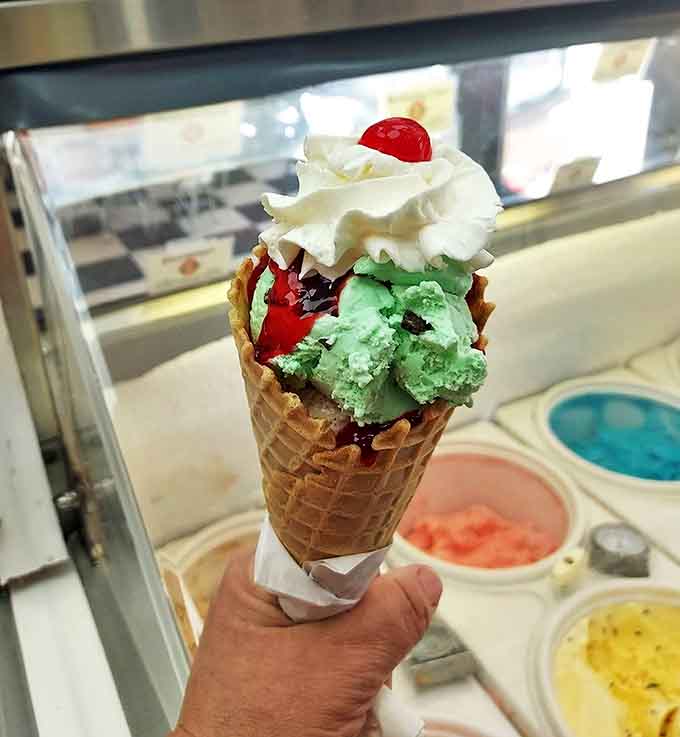 A perfect scoop of mint chocolate chip crowned with cherry royalty &ndash; the kind of ice cream that makes adults remember what childhood tastes like.