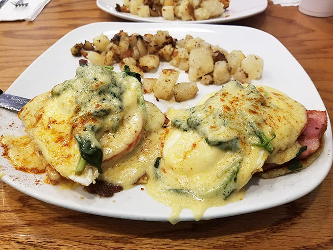 The Eggs Florentine variation brings vibrant spinach to the party, proving that sometimes you can improve on perfection with a little green.